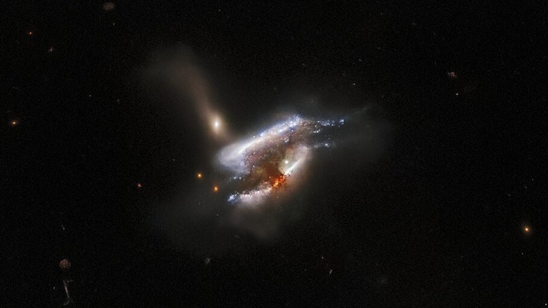 New Hubble Telescope image shows three galaxies violently merging into one