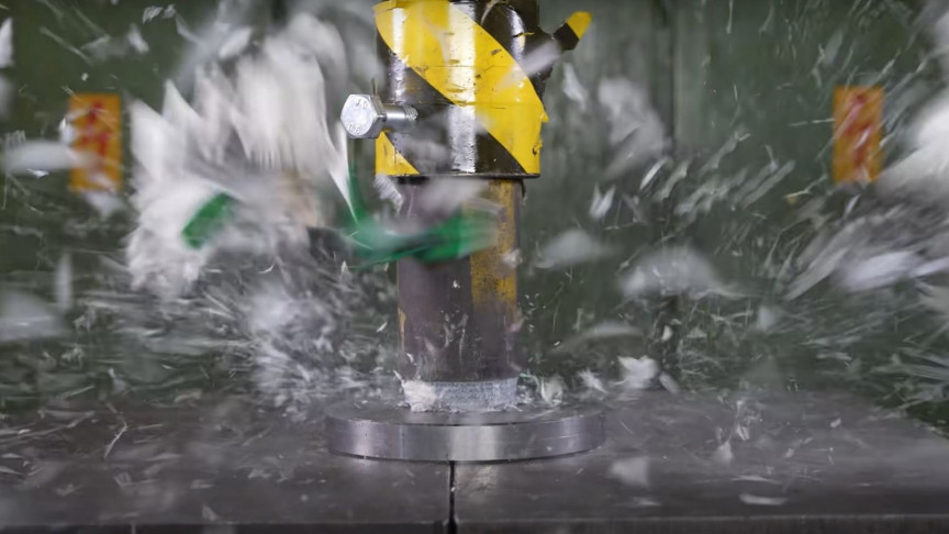 Watch a 150-ton hydraulic press break down while crushing a stack of ...